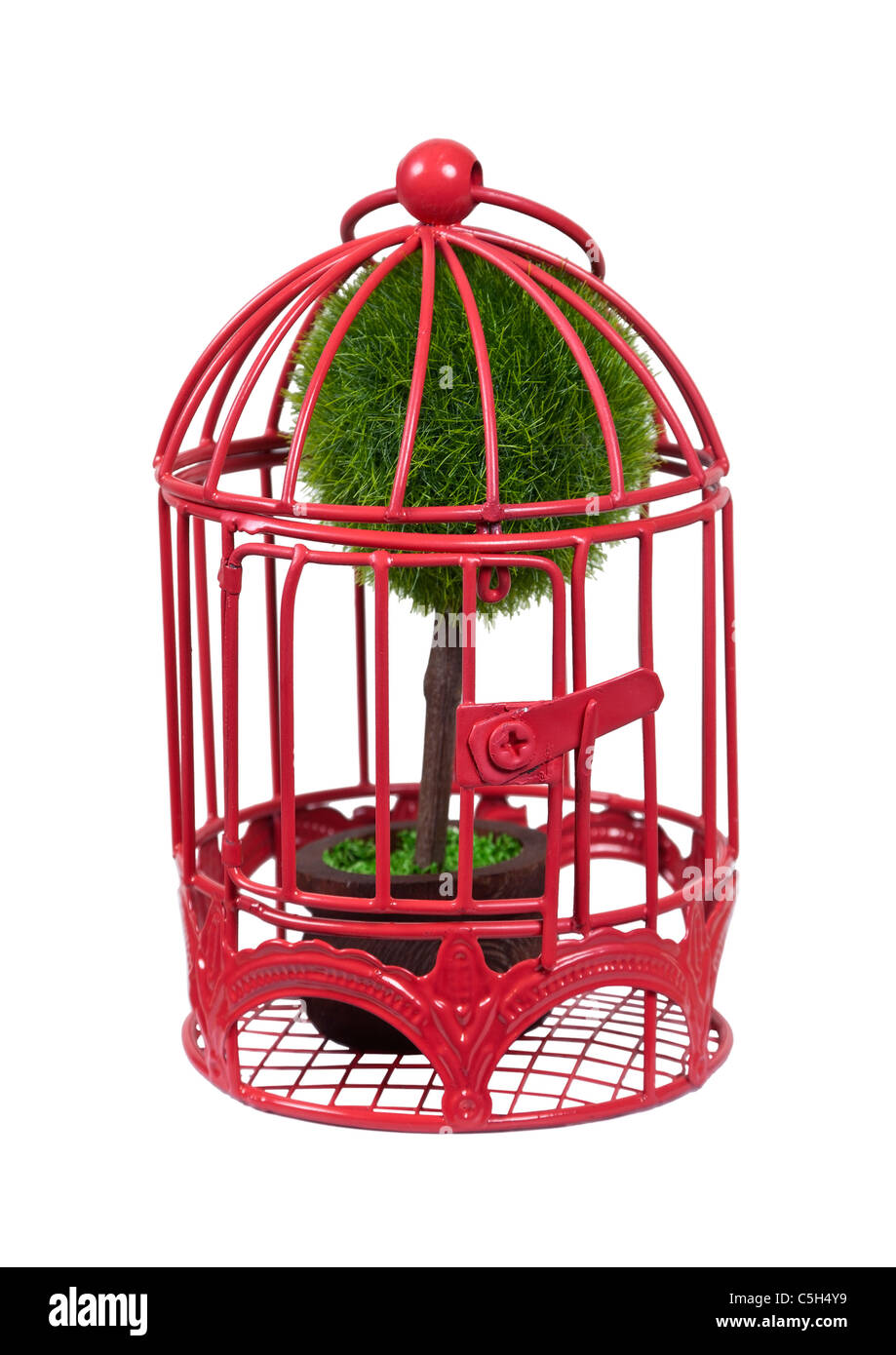 Nature caged shown by a potted tree in a red metal bird cage - path ...