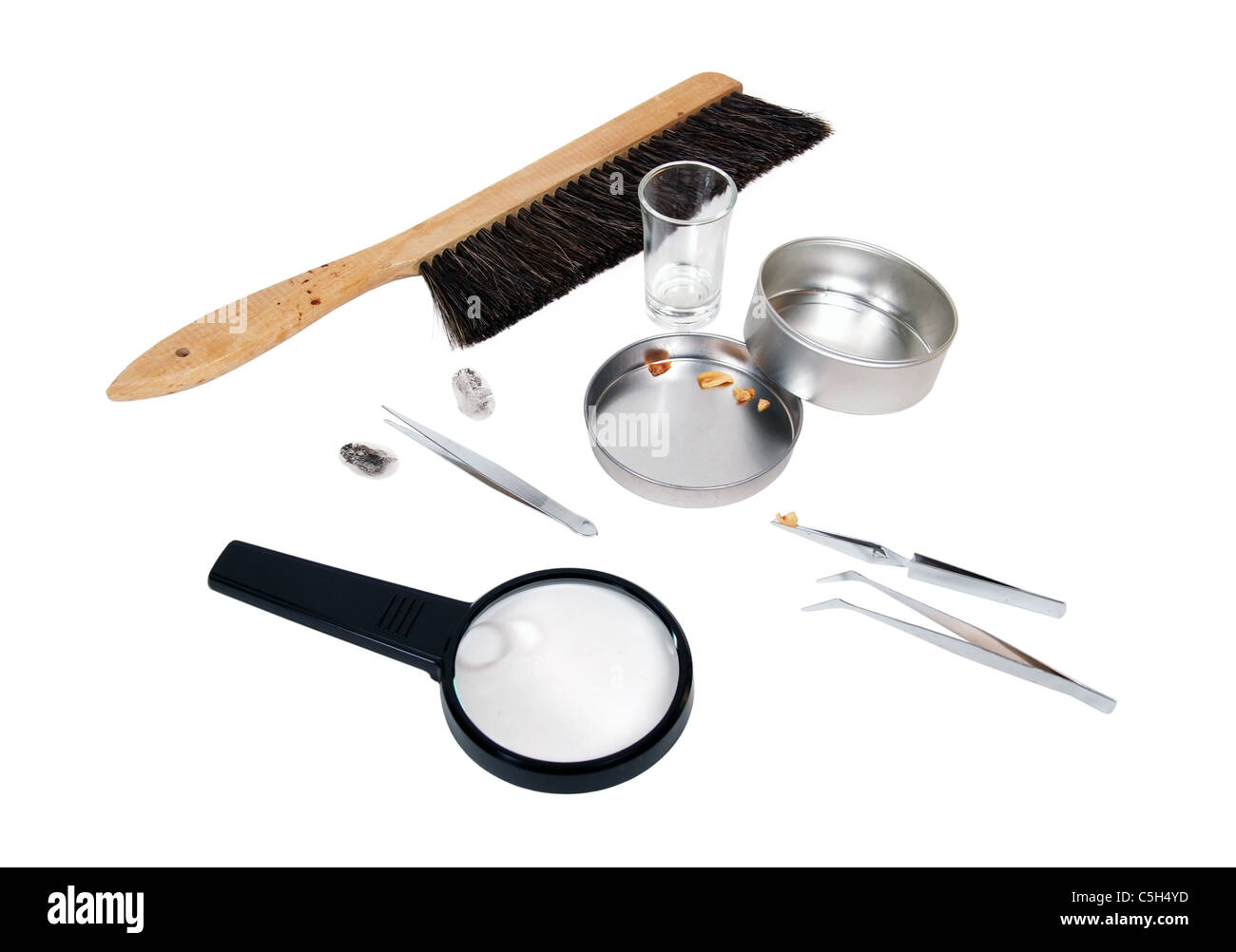 Magnifying glass, brush and tweezers to obtain evidence - path included ...