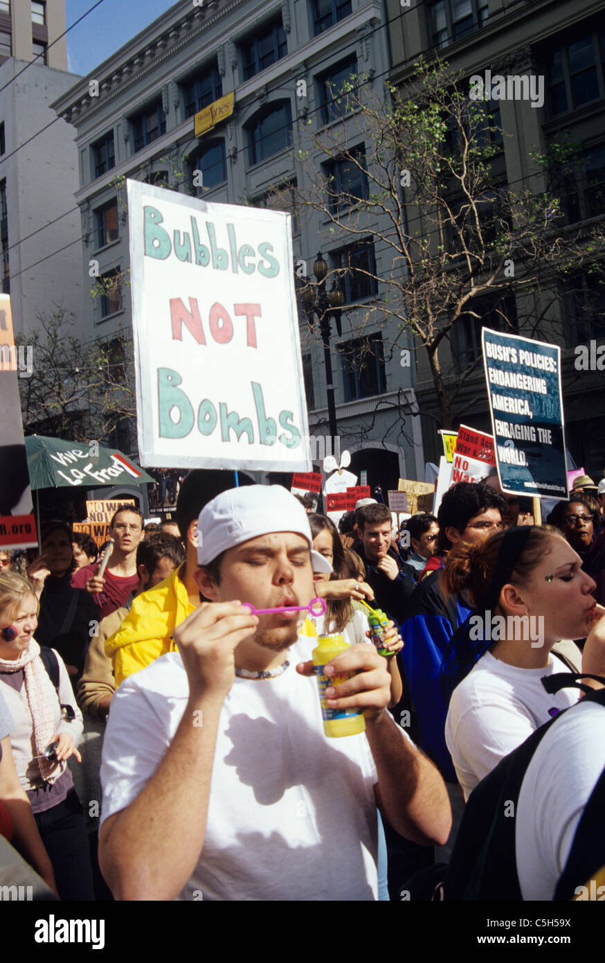 marcher in anti iraq war protest march has sign bubbles not bombs as he ...