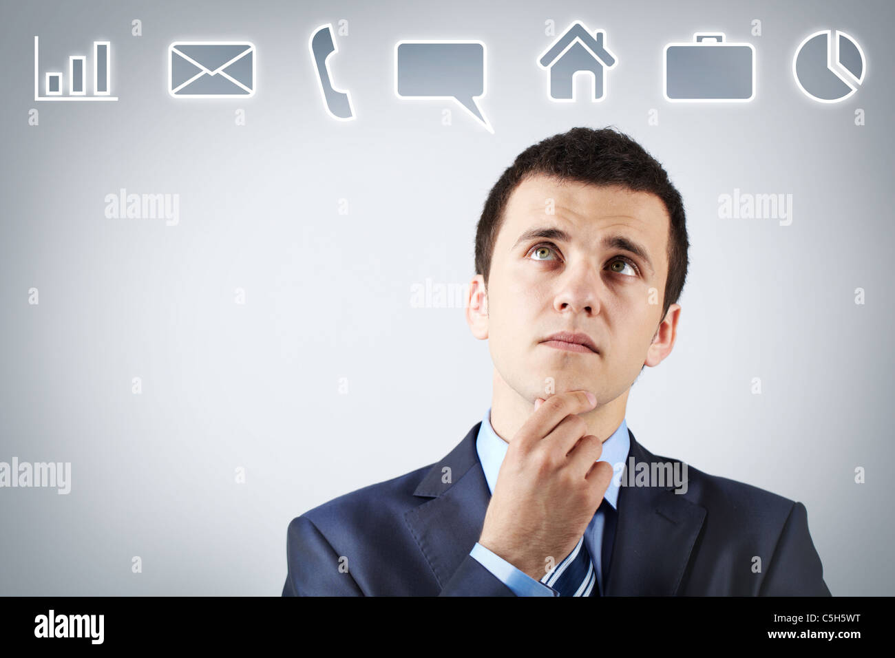 Portrait of pensive man thinking of what to do first Stock Photo - Alamy
