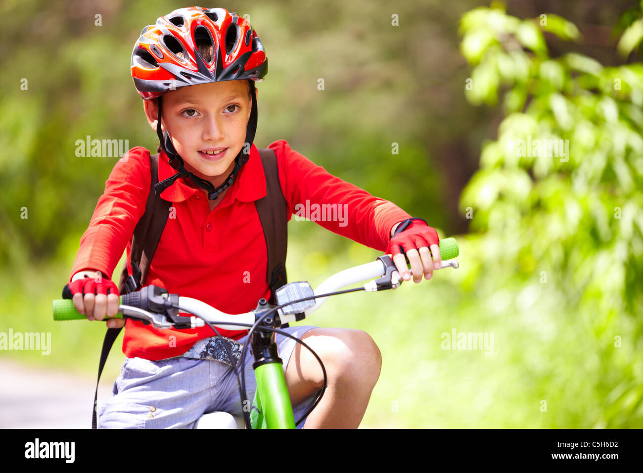 Portrait of a cute boy on bicycle Stock Photo - Alamy