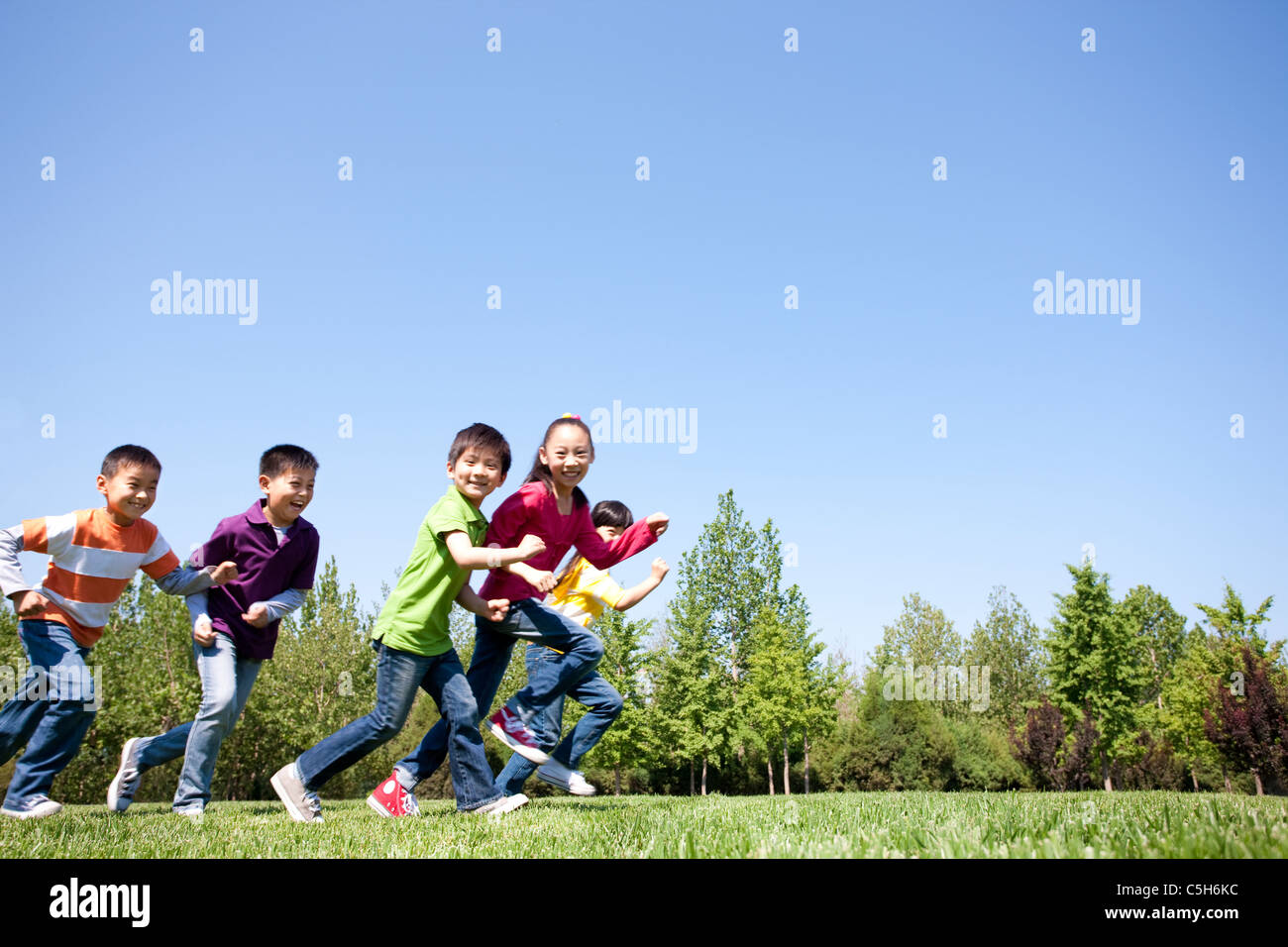 Children Racing at Park Stock Photo - Alamy