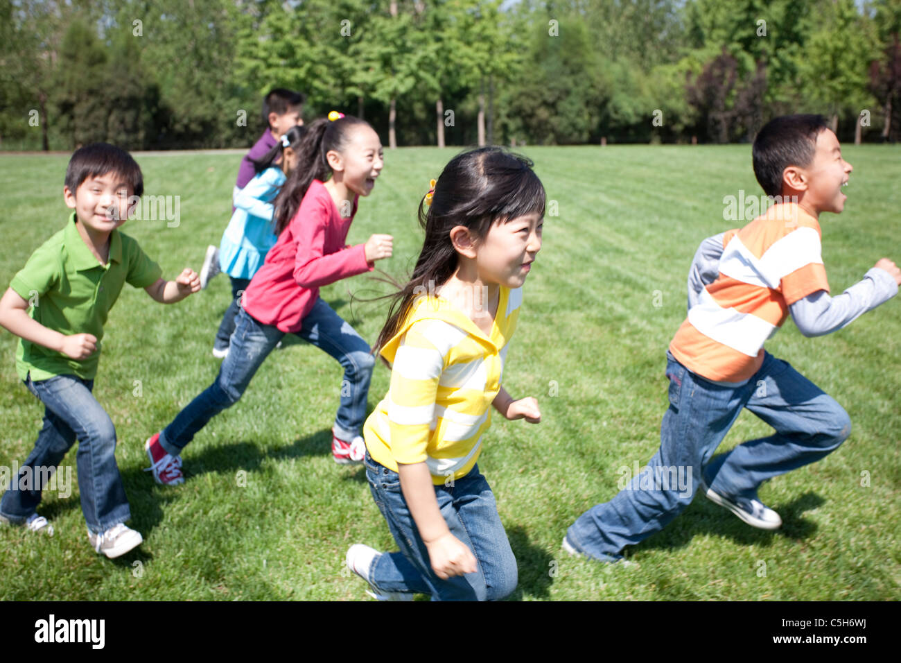 Child Running Across Grass High Resolution Stock Photography and Images ...