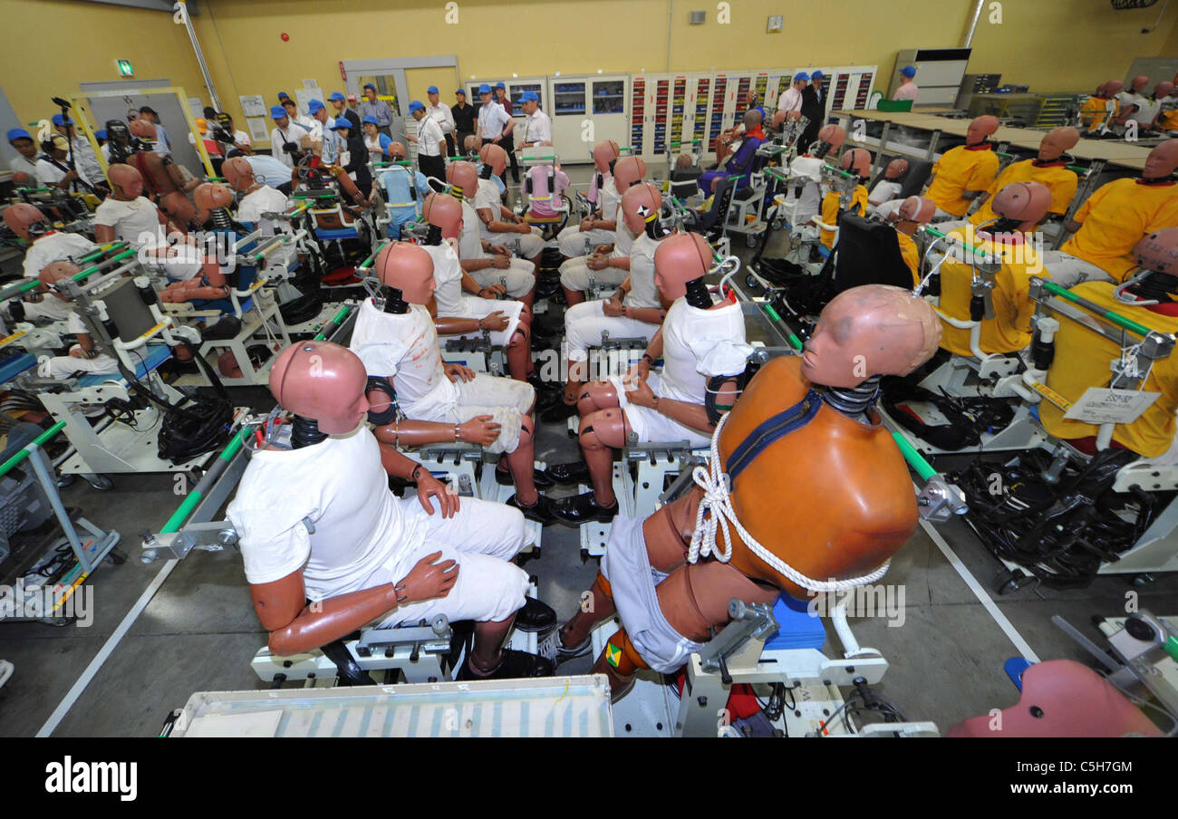 Various types of dummies for experiments stand by in their waiting room ...