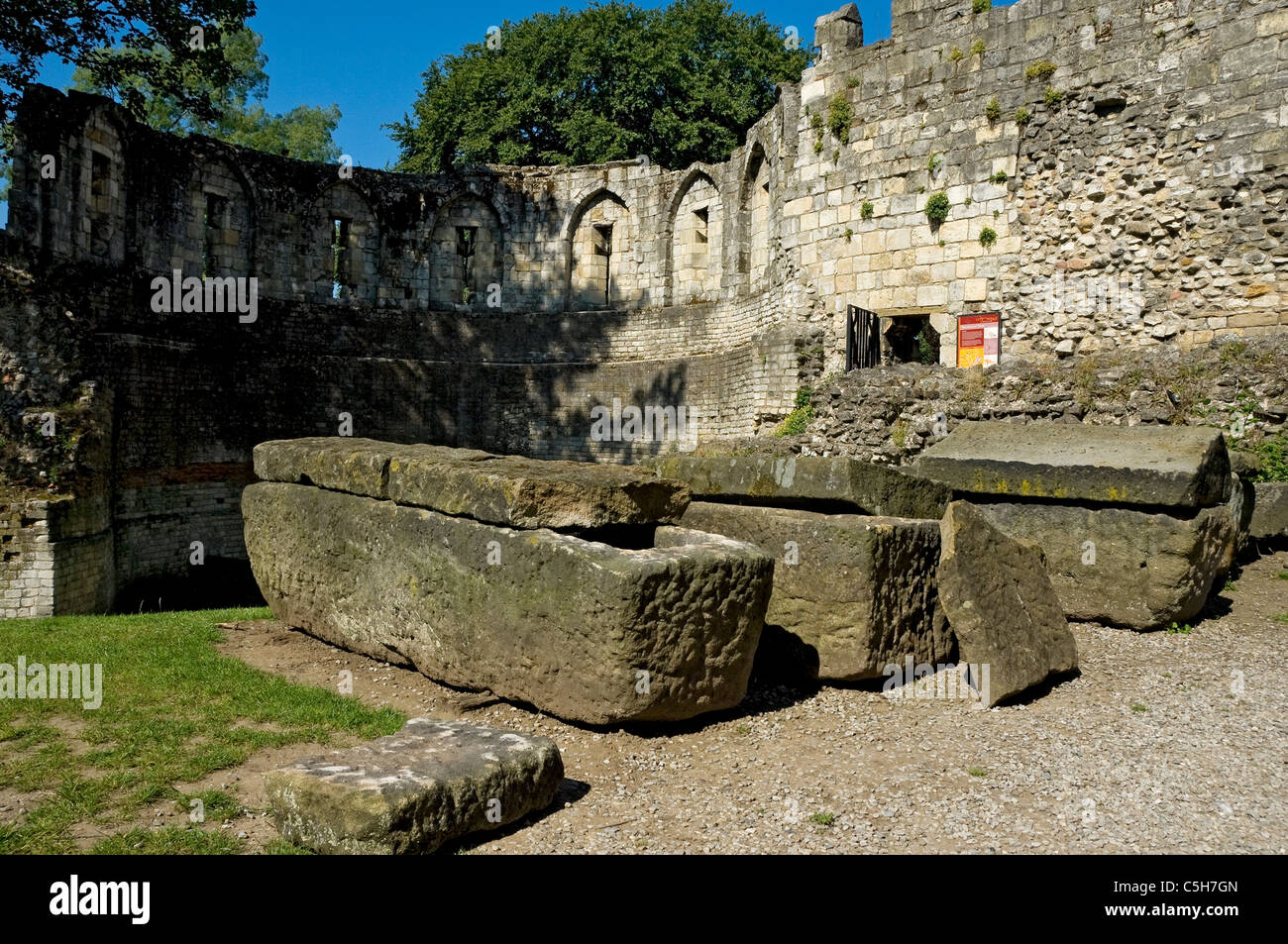 Old stone coffins beside the Multangular Tower in summer York North ...