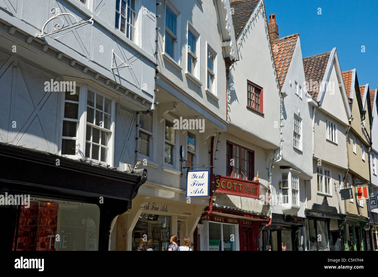 Close up of facade of old buildings shops building shop in summer Low ...