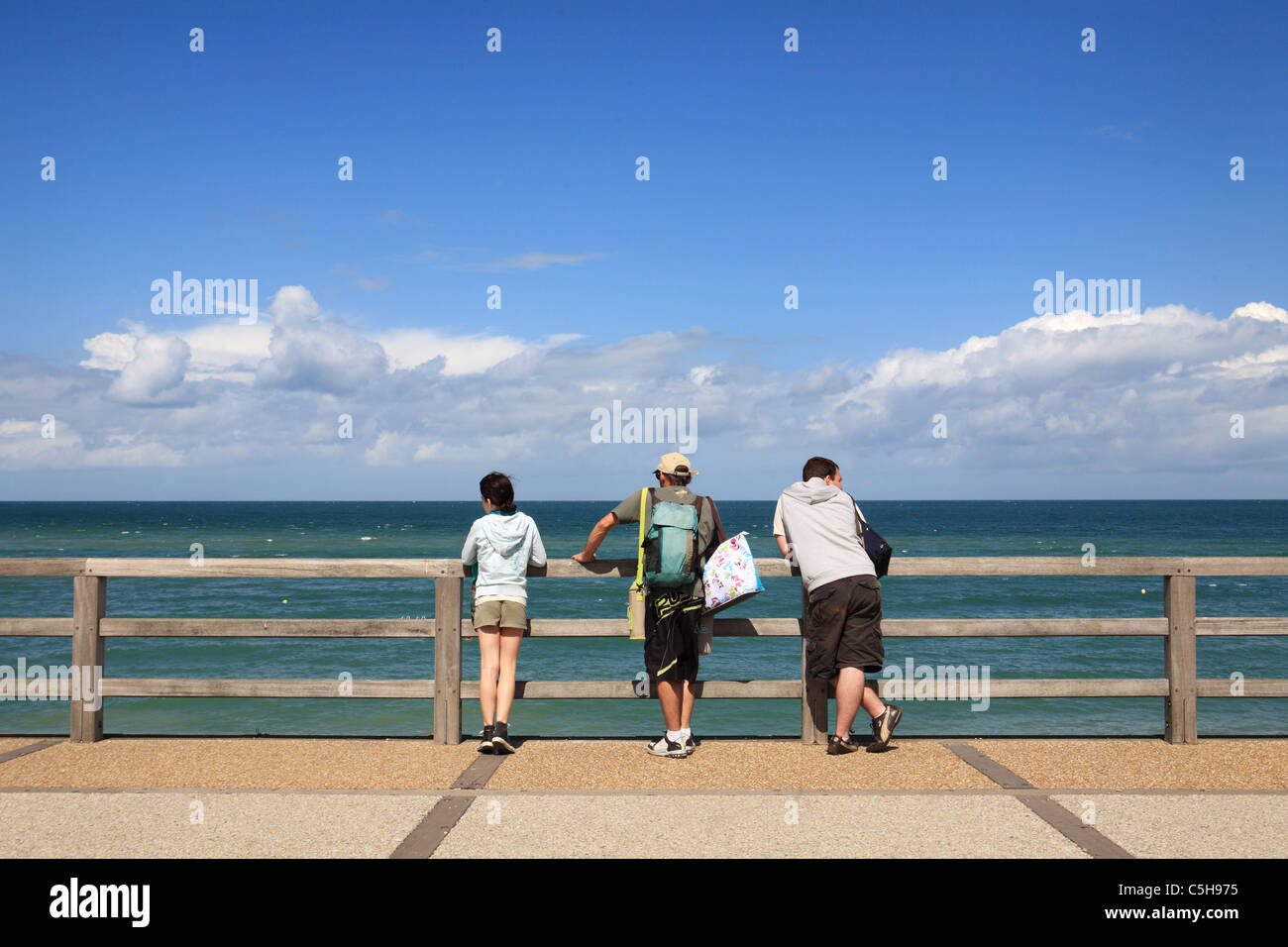 Girl looking over railing hi-res stock photography and images - Alamy