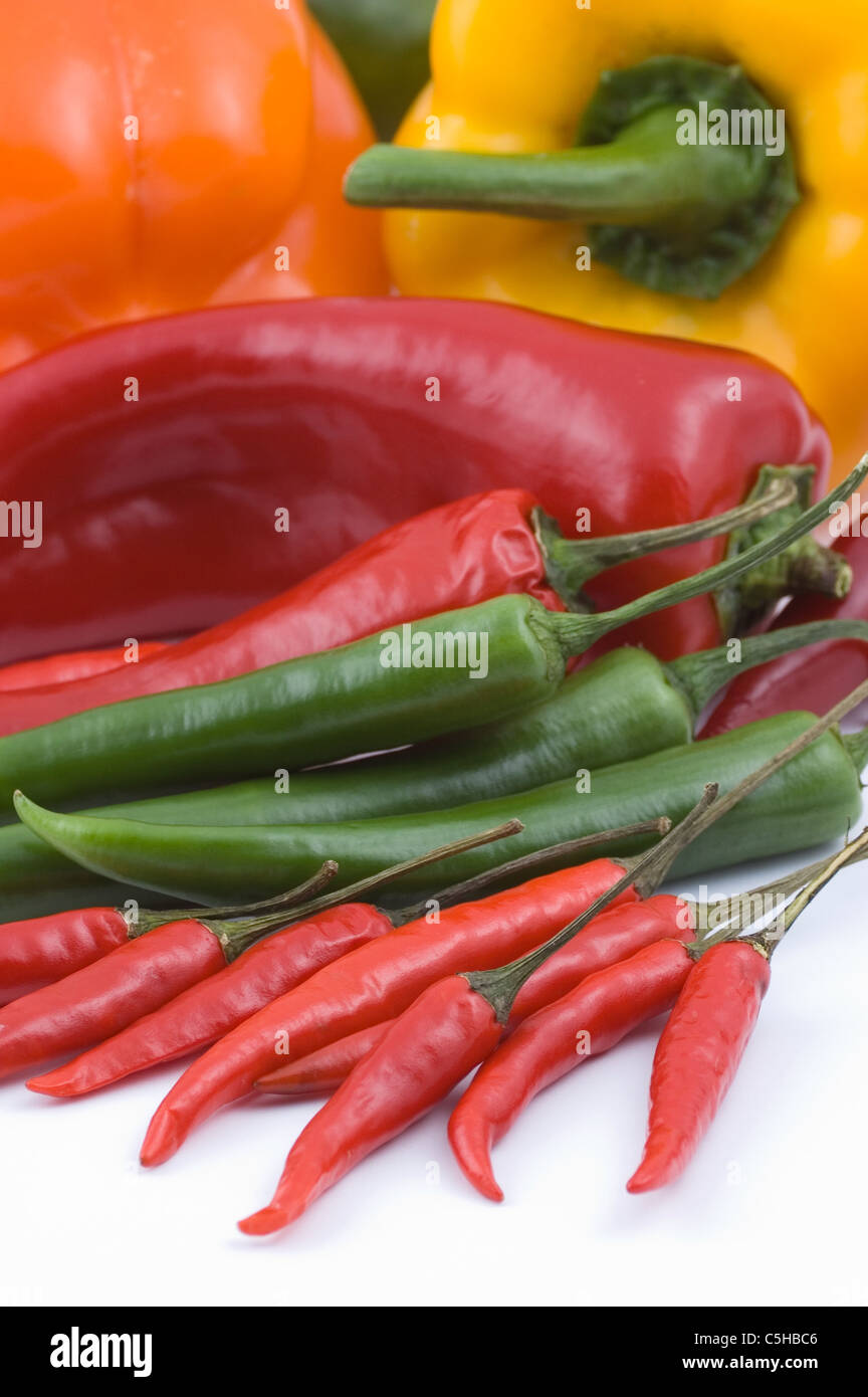 Different kinds of pepper on white background Stock Photo - Alamy