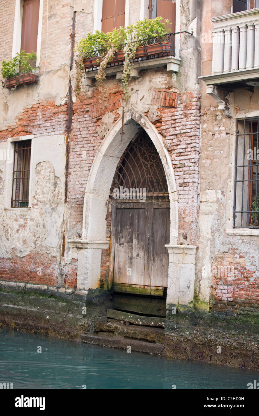 An arched doorway on a canal, Venice, Italy Stock Photo - Alamy