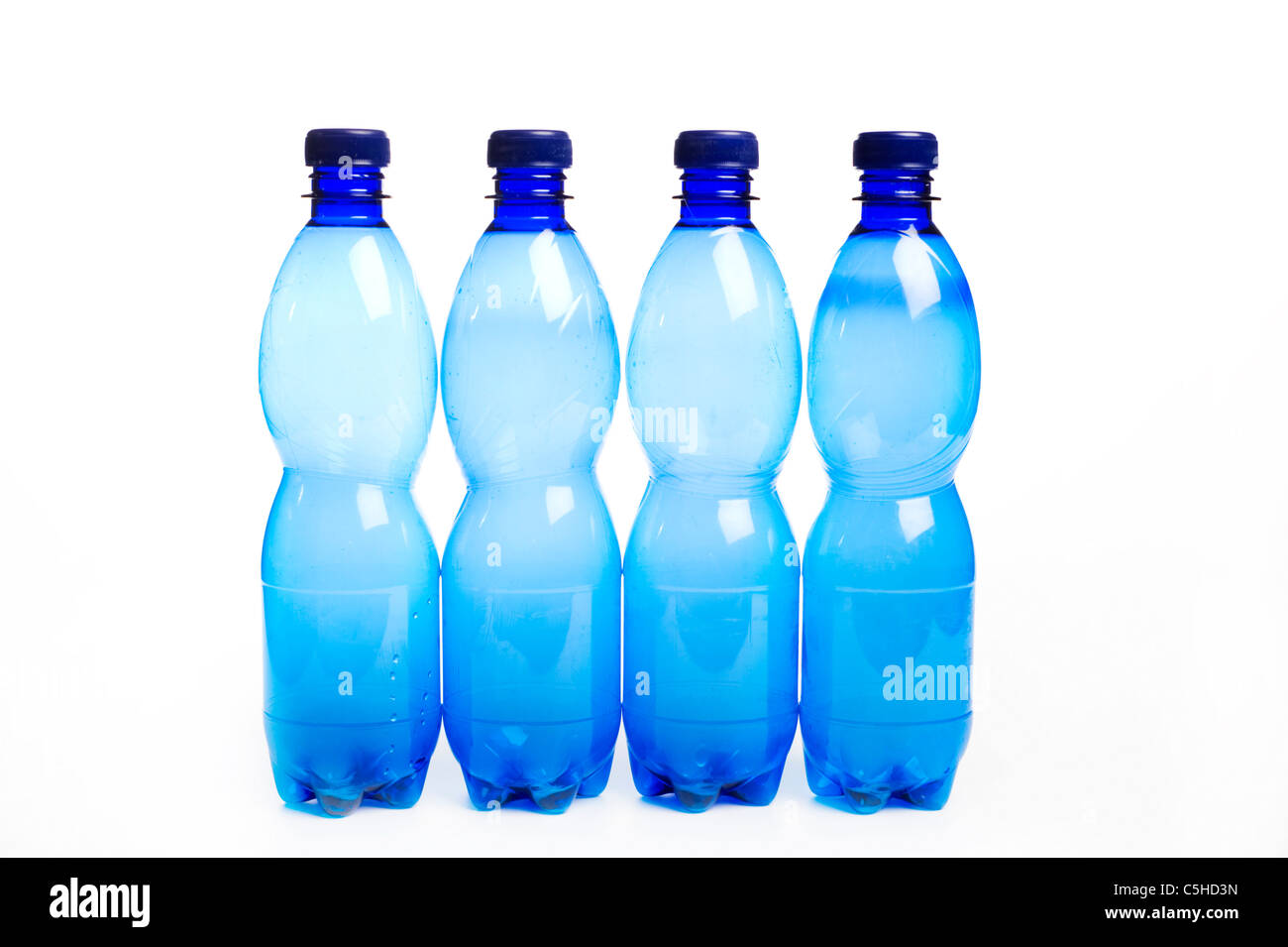 blue plastic bottle in a row Stock Photo - Alamy