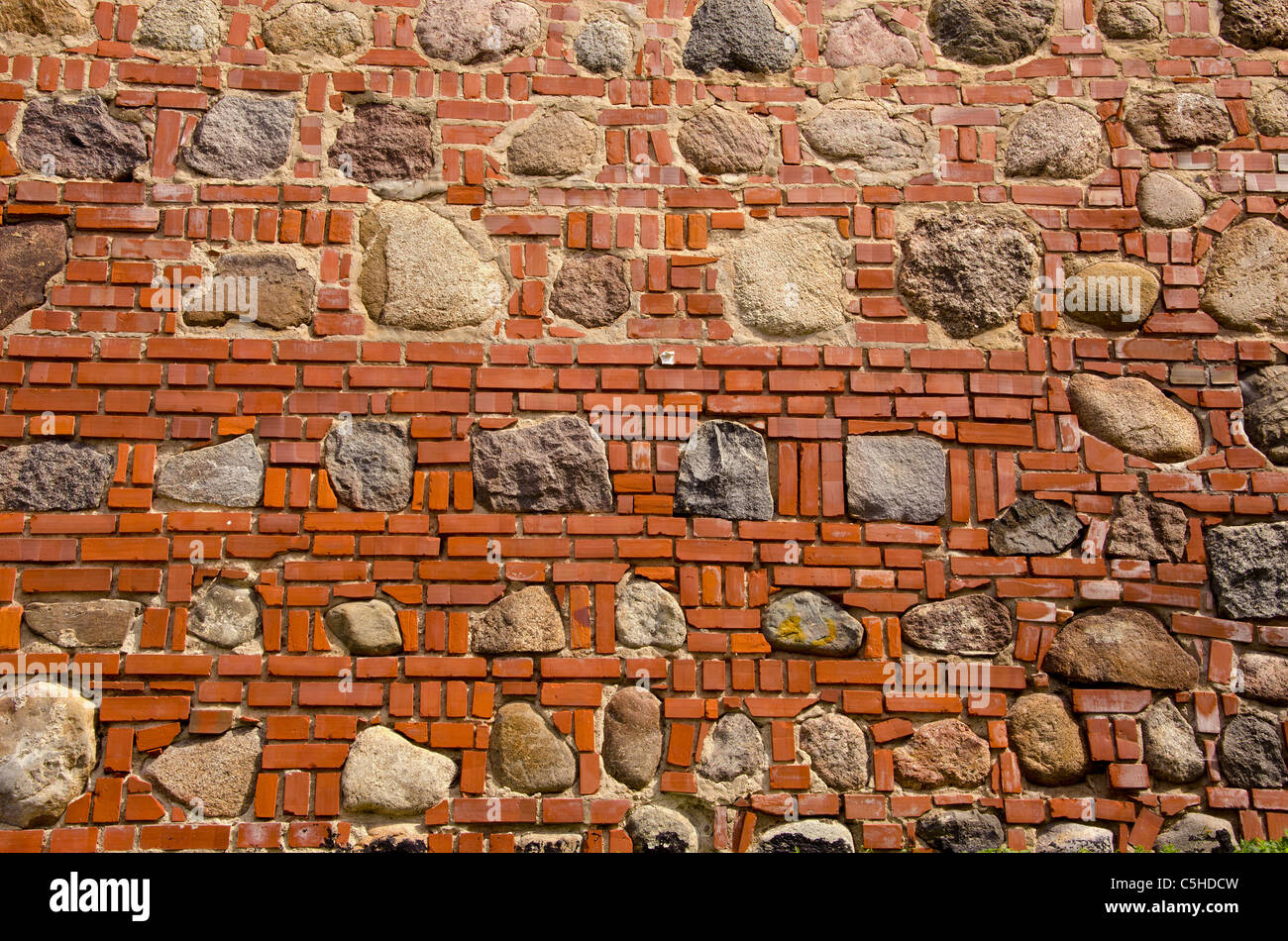 red bricks and stones historical wall background Stock Photo - Alamy