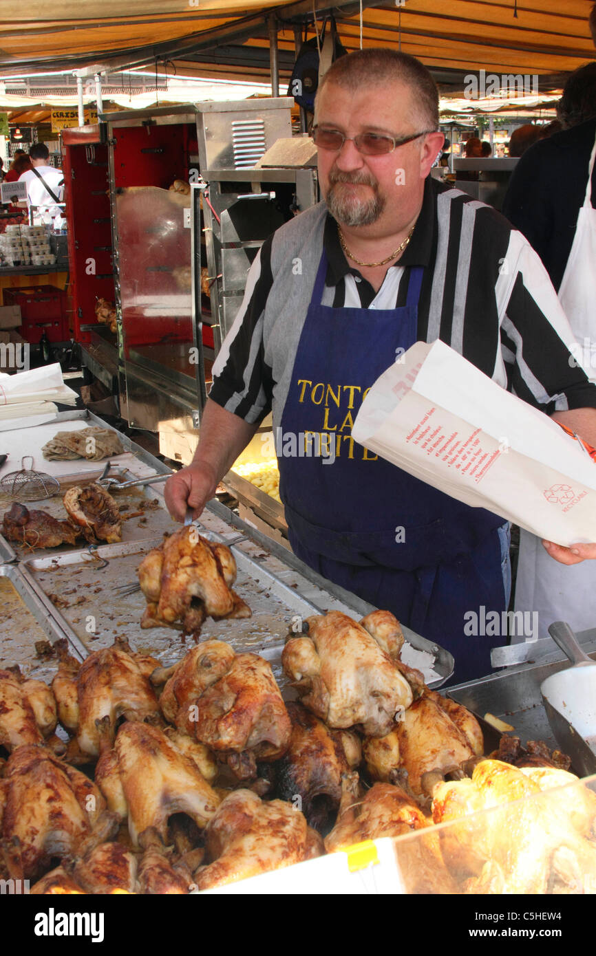 Man selling rotisserie chicken Versailles market stall Stock Photo - Alamy