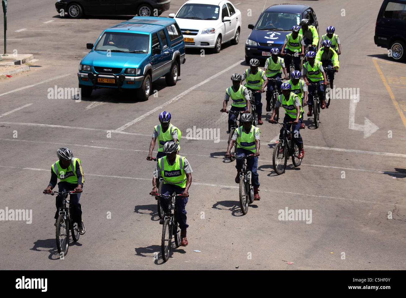 Members of the Zimbabwean Police Force cycle in Bulawayo, Zimbabwe ...