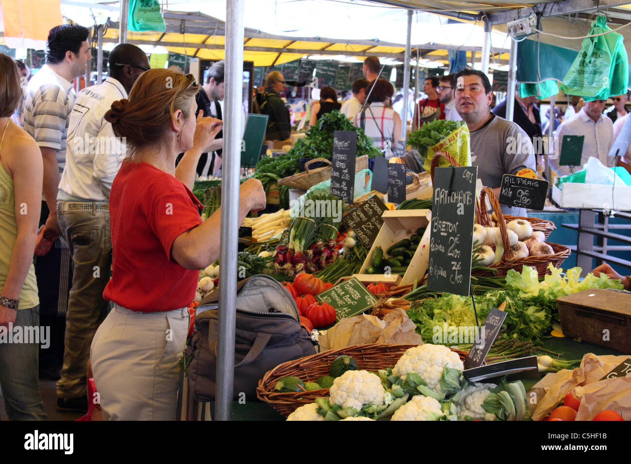 Buying vegetables at a French market stall in Versailles Stock Photo ...