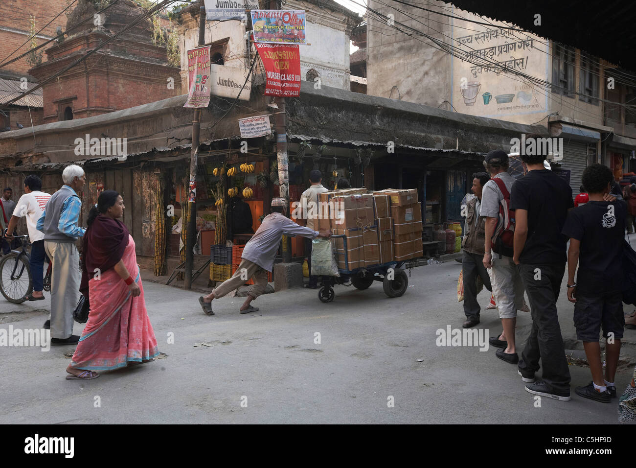 Street scene, Man pushing large load on his back, Kathmandu, Nepal ...