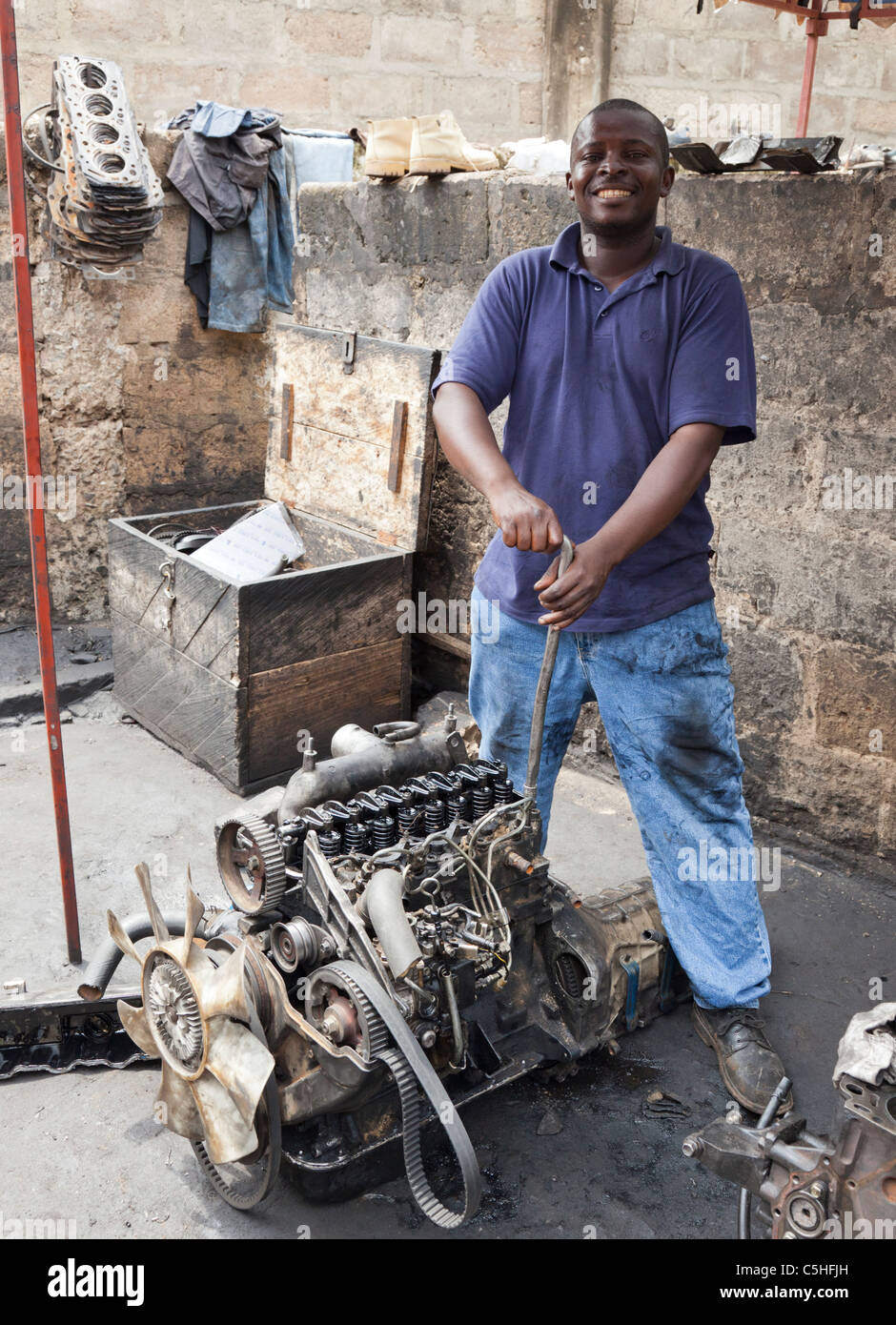 An African man repairing a car engine. Accra, Ghana Stock Photo - Alamy
