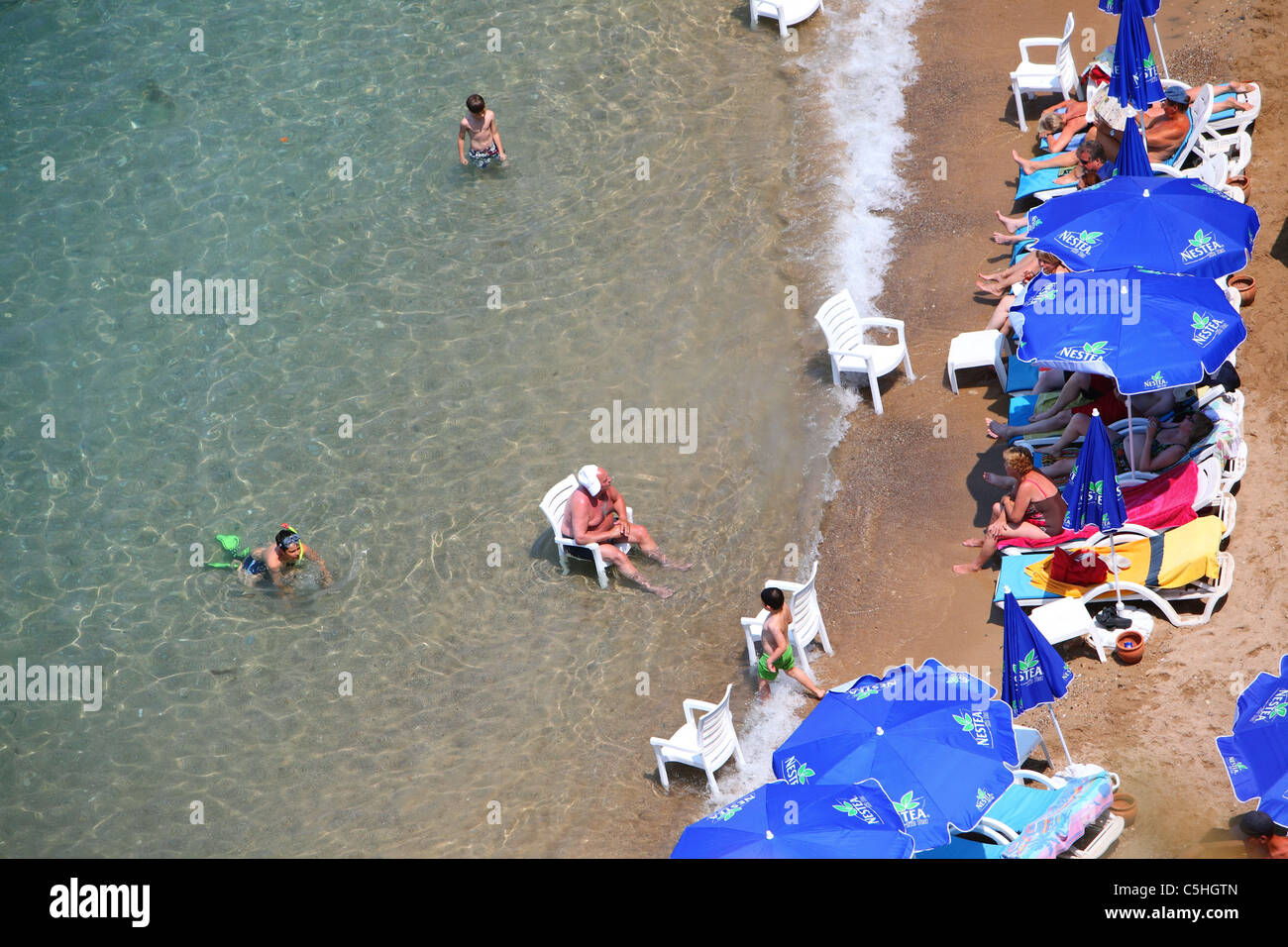Tourists sunbathing on beach marina hi-res stock photography and images ...