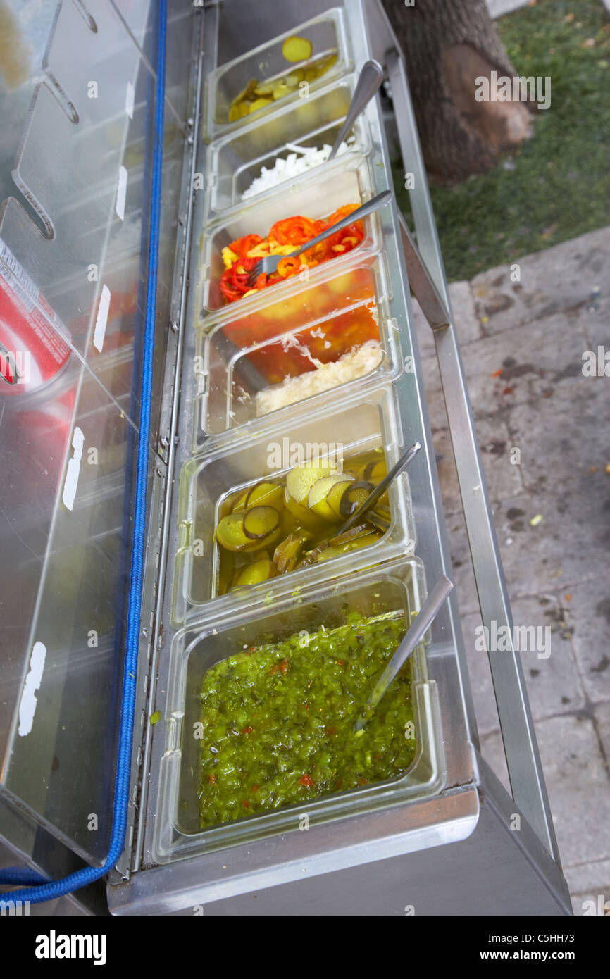 various dressings and toppings on a hot dog fast food stall in toronto ...