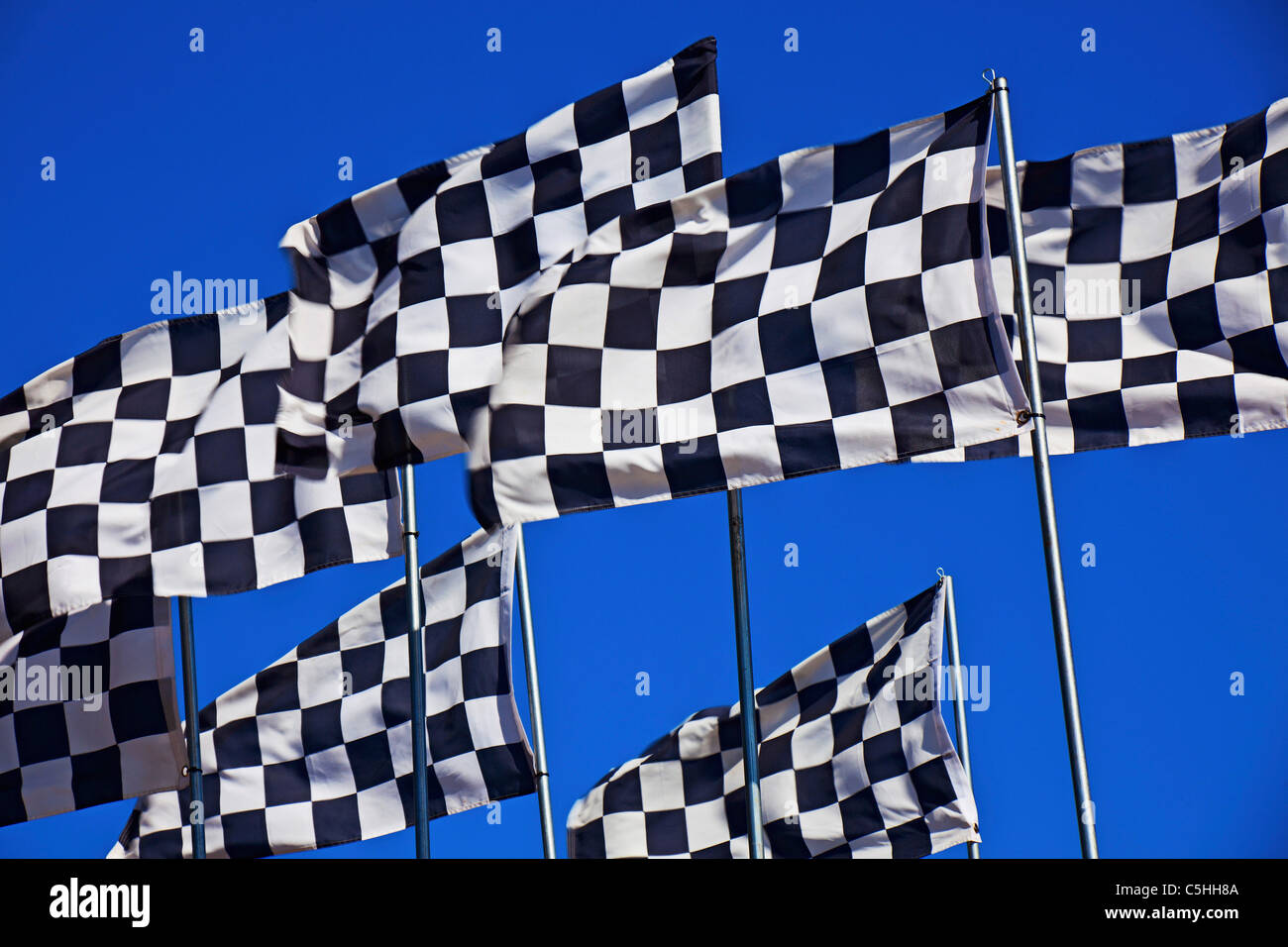 Checker flag against blue sky Stock Photo - Alamy
