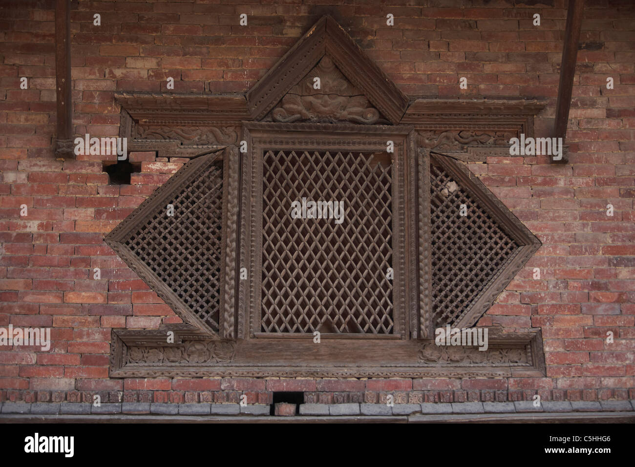 Wooden window frame and carving on the Newari-style pagoda of the ...