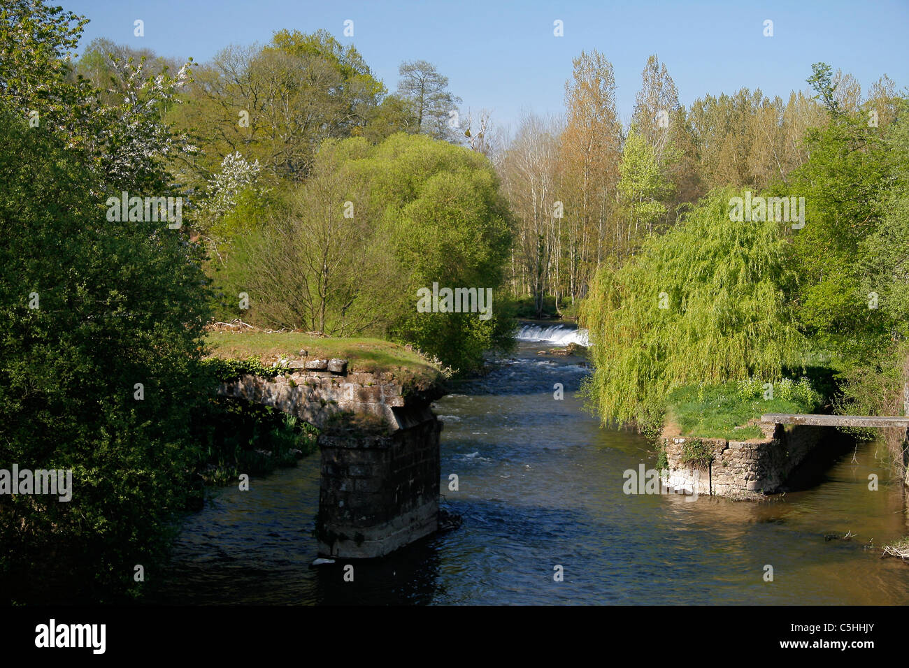 A river lined with trees, in the spring, old bridge, "La Varenne", Orne ...
