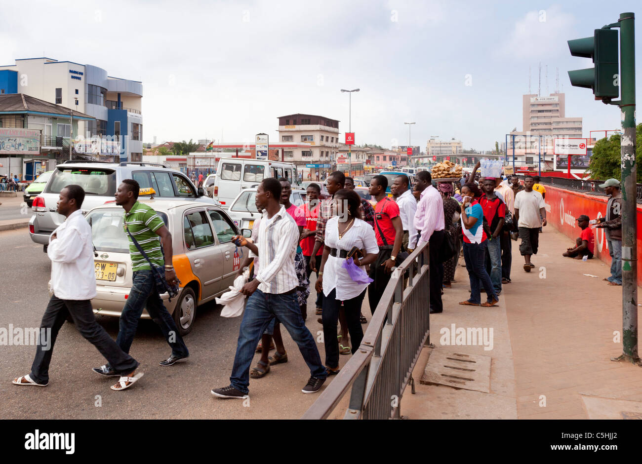 People crossing a busy street in rush hour. Accra, Ghana Stock Photo ...