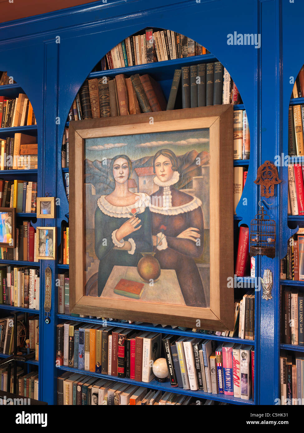 blue bookshelf with painting Stock Photo - Alamy