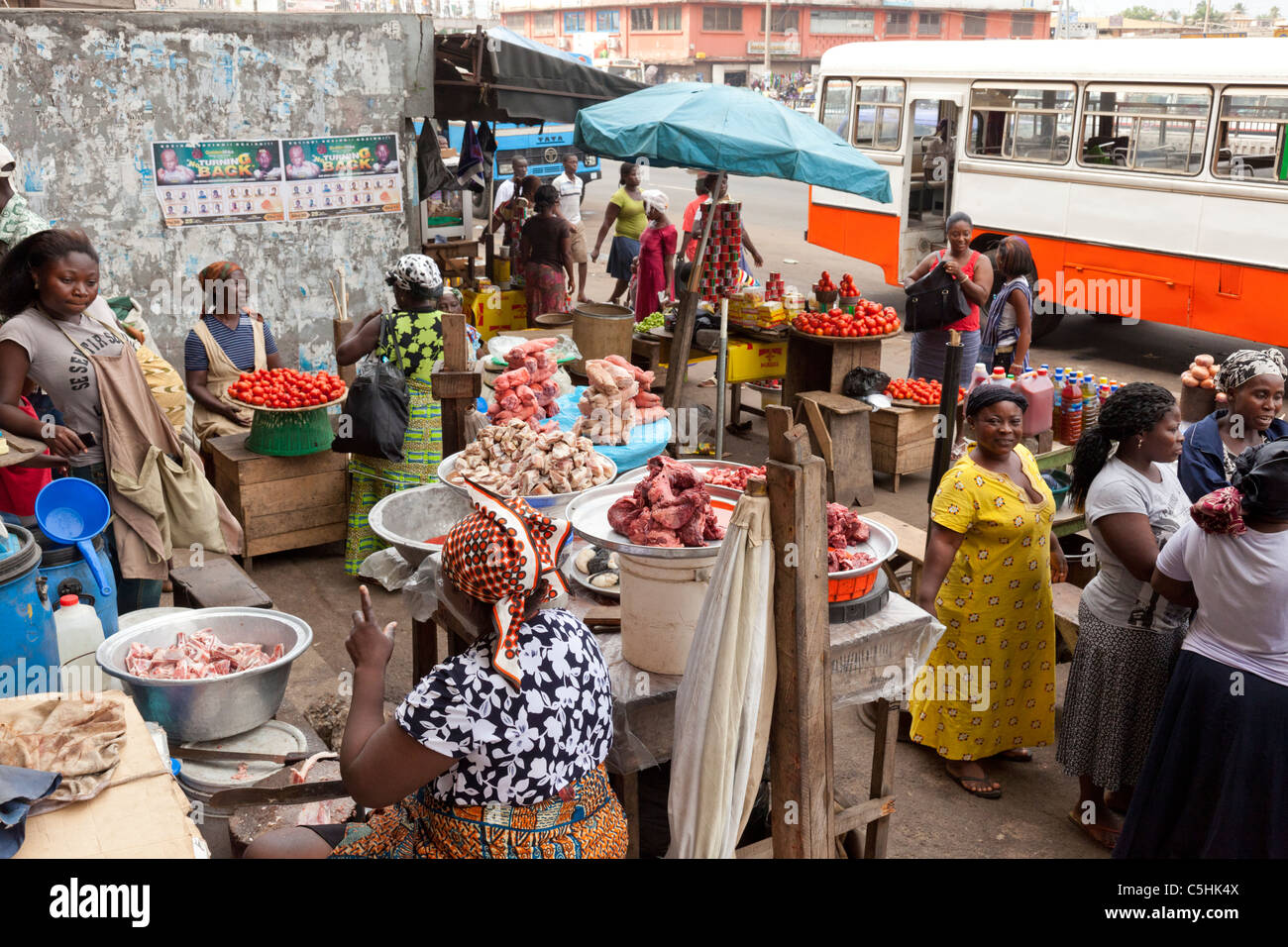 Market Street Scene with market traders selling a range of fresh meat ...