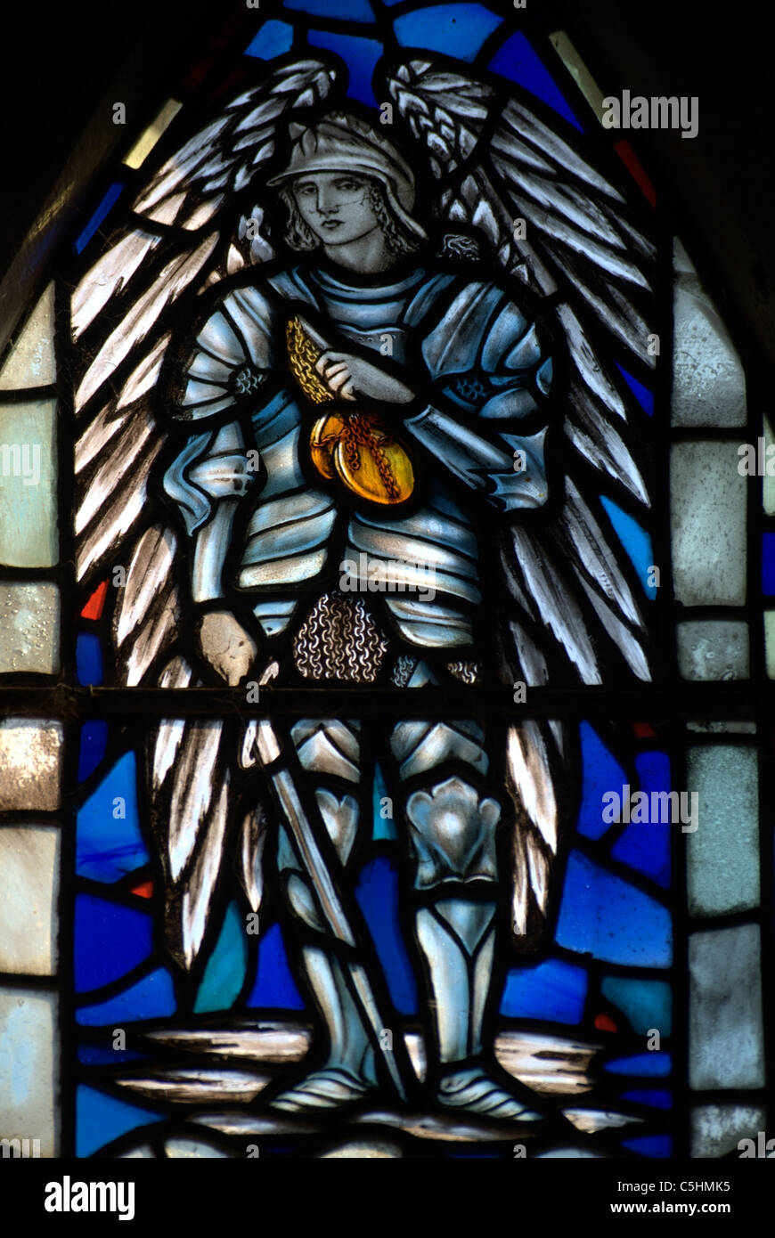 St.Michael the Archangel dressed in traditional armour with sword, and ...