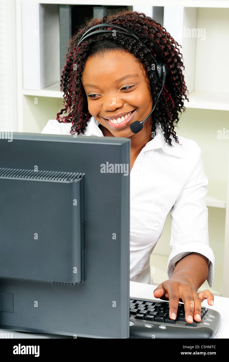 African American Woman Working On A Computer At A Call Center Stock ...