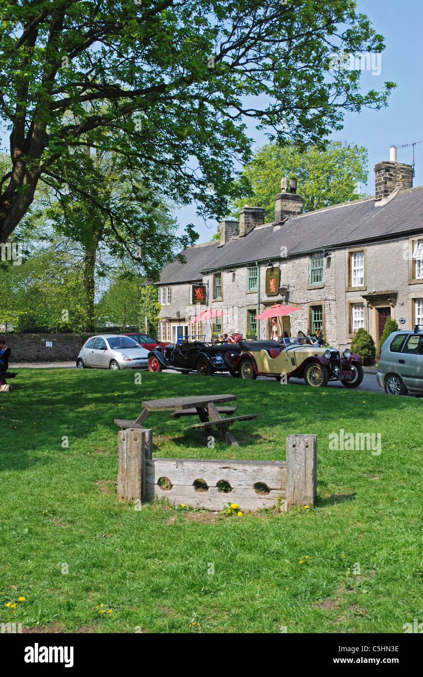 Village green at Litton in Derbyshire England with old stocks and ...