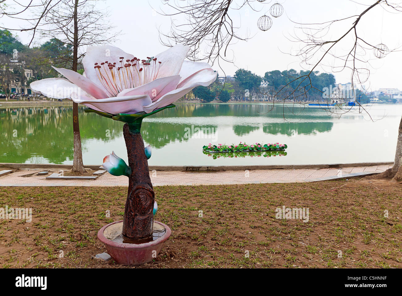 Large statue of lotus flower (with real lotus flowers on a floating ...