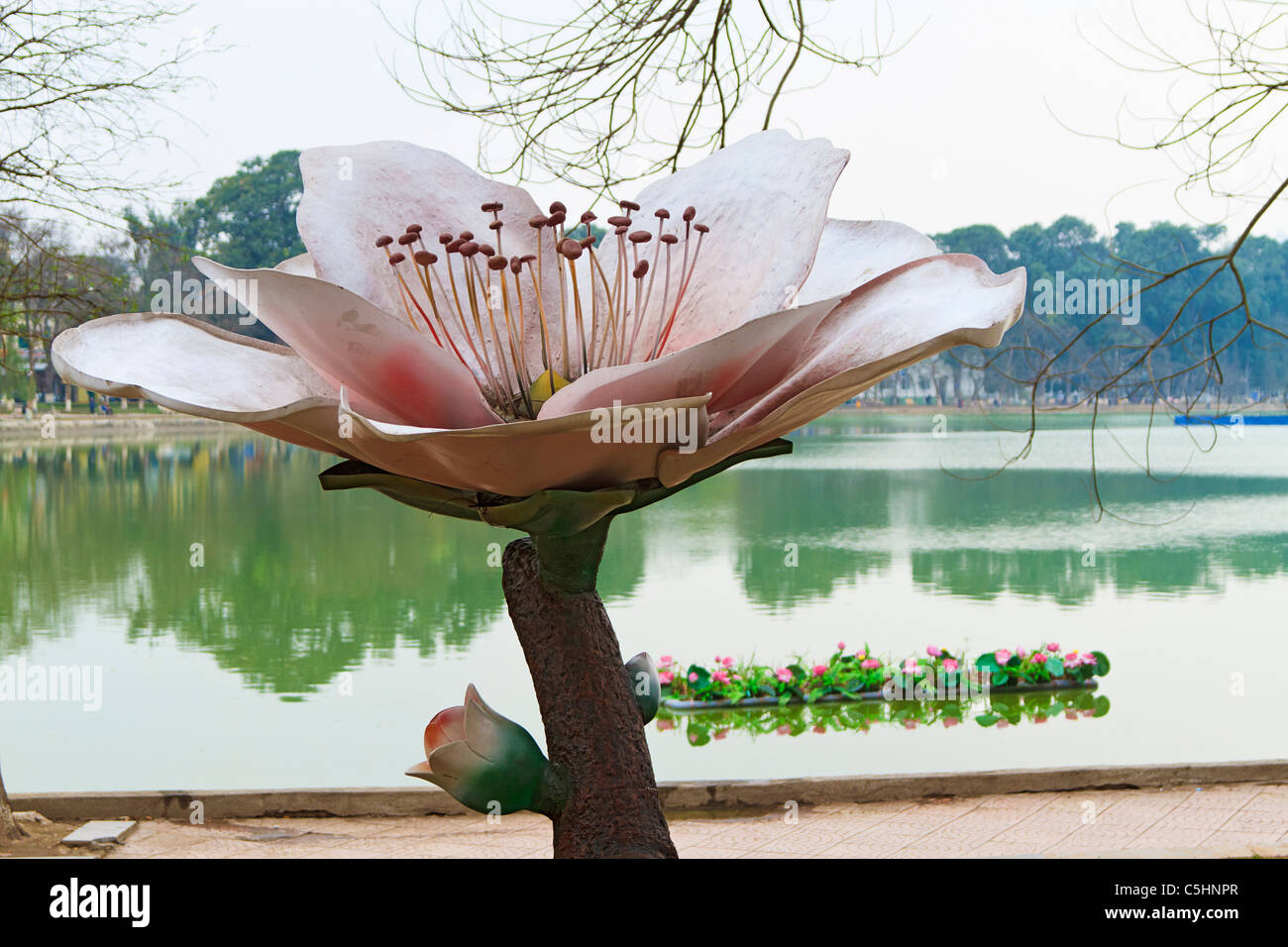 Large statue of lotus flower (with real lotus flowers on a floating ...