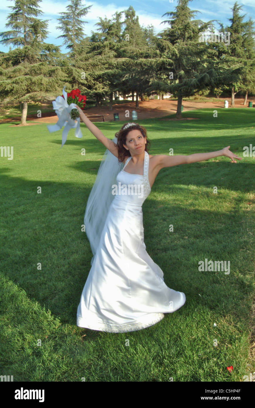 An excited and happy bride right after she has gotten married with her ...