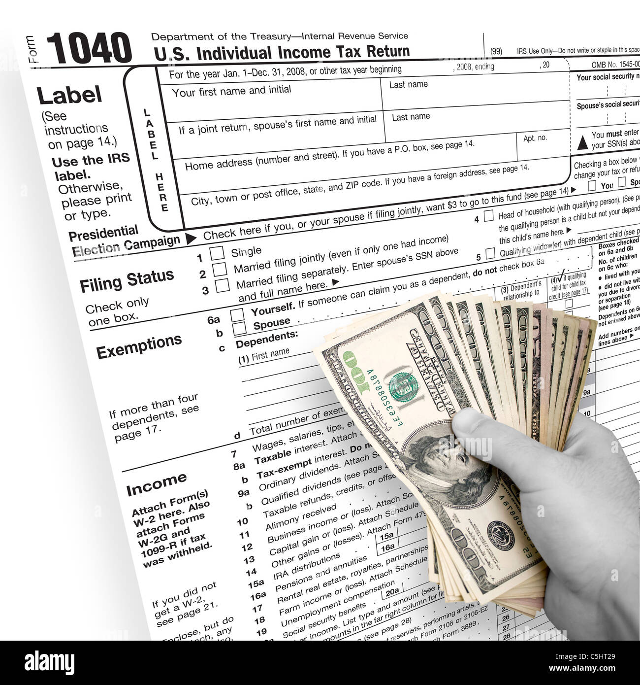 A tax time themed montage for US taxpayers with a hand full of money ...