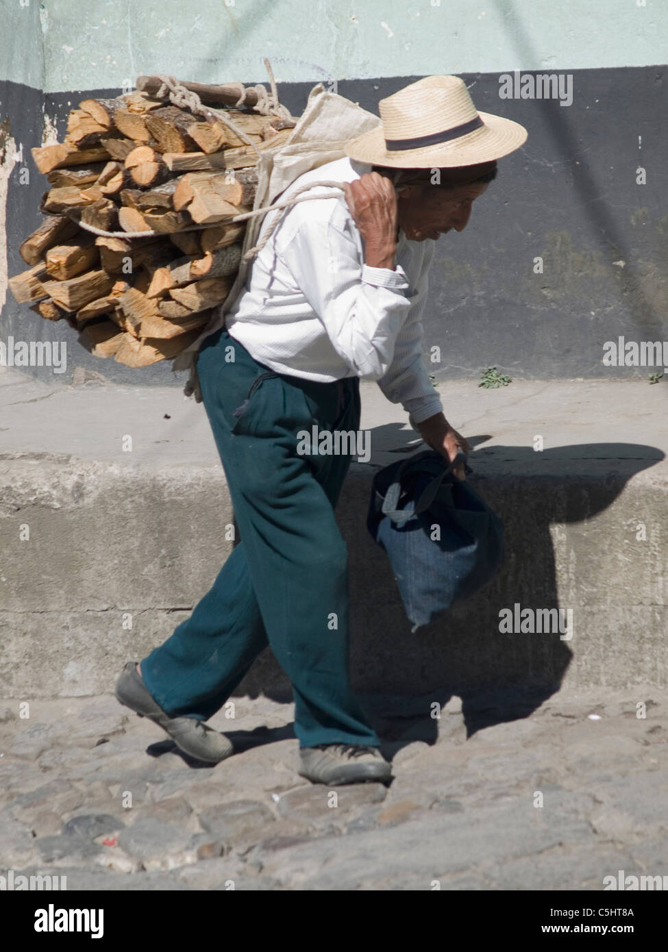 Chichicastenango, Guatemala 1/7/07 Local residents carry goods to ...