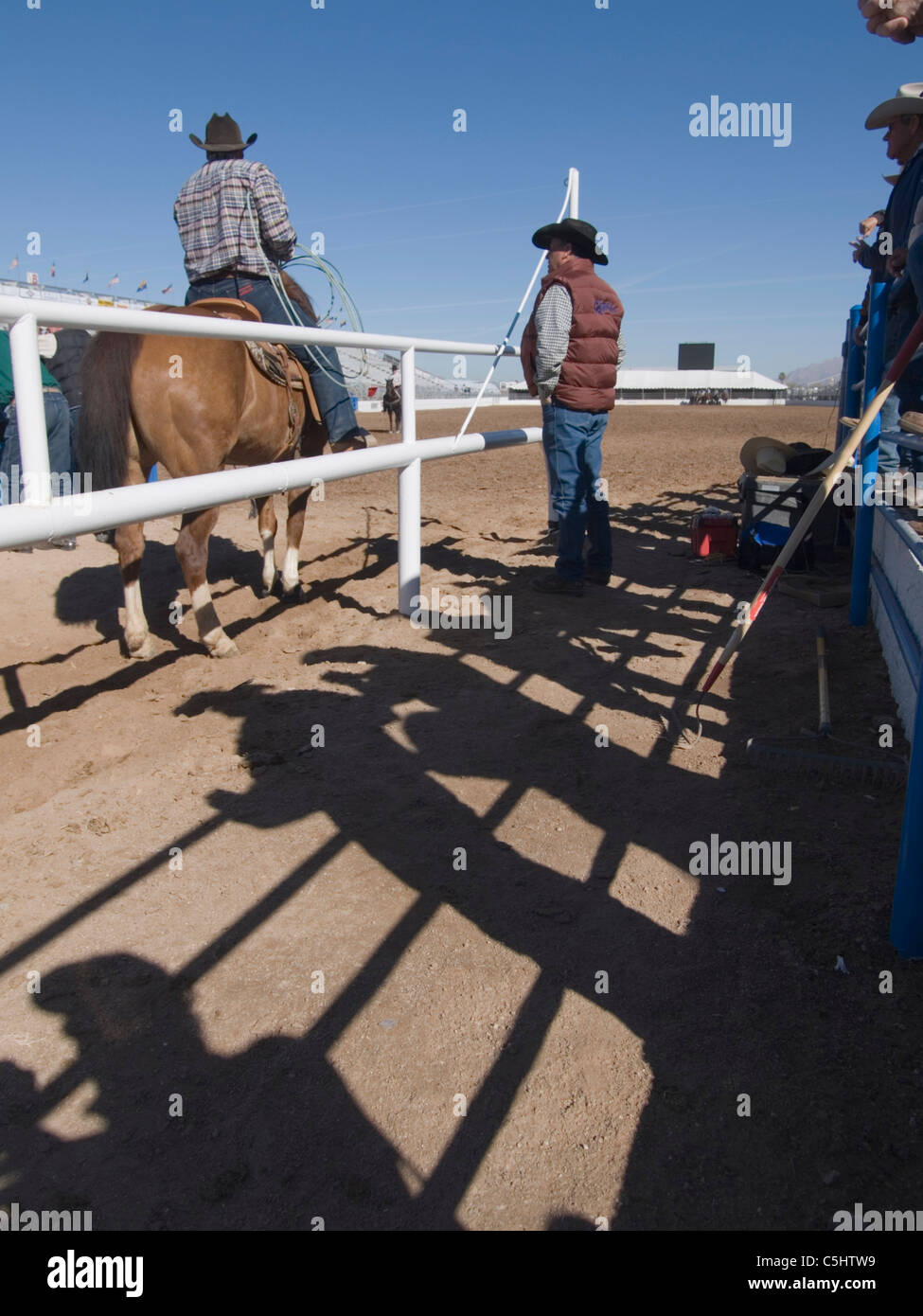 Shadows of Rodeo competitors watching the performance at the Tucson ...