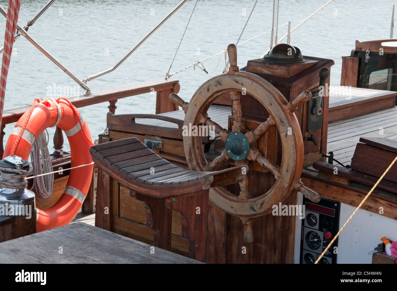 Wooden ship's wheel on a large sailing vessel in the harbour at Cabo de ...