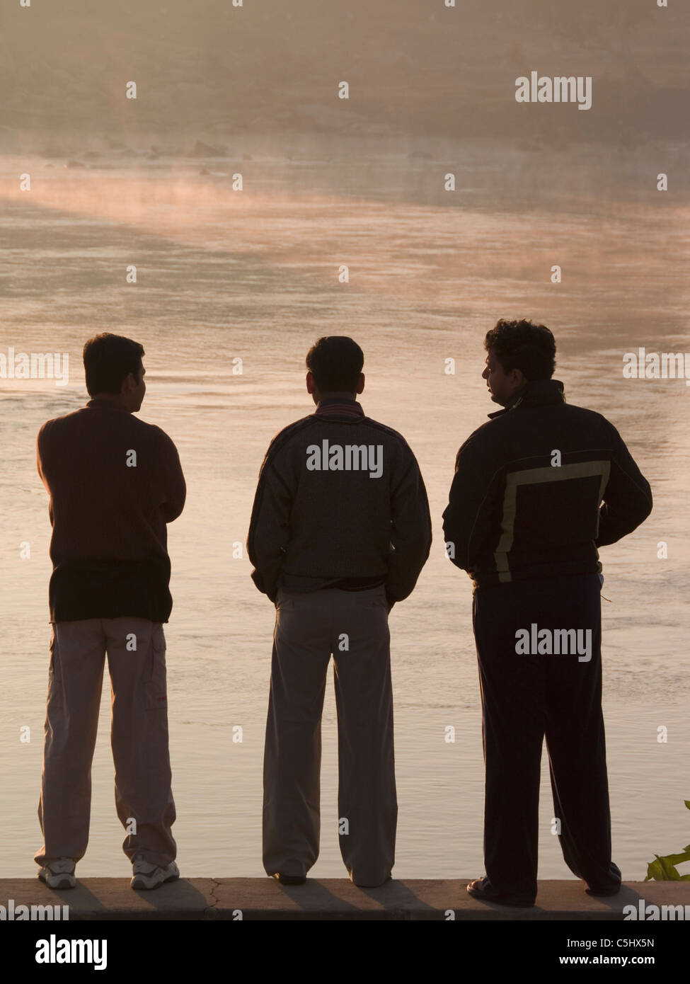 Three men talk hi-res stock photography and images - Alamy