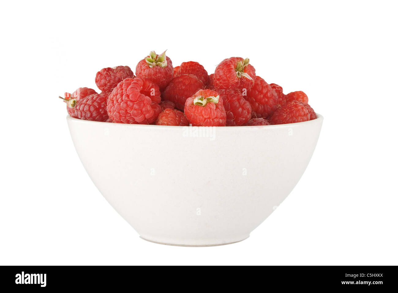 front view of full bowl with ripe raspberry on white background Stock ...