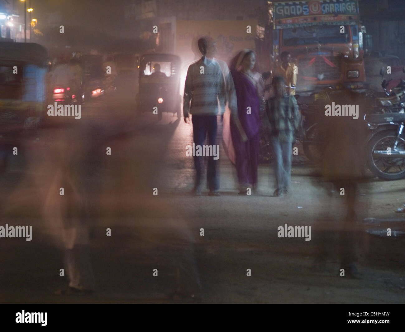 People walking at night on street of small town of Naroda, Gujarat ...