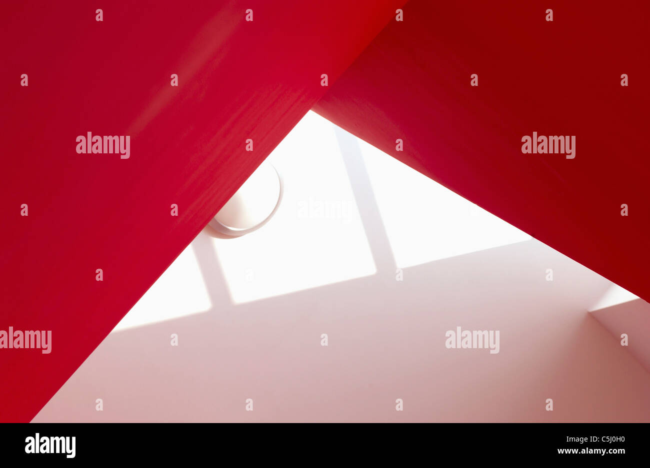 Red walls meet white ceiling Stock Photo - Alamy