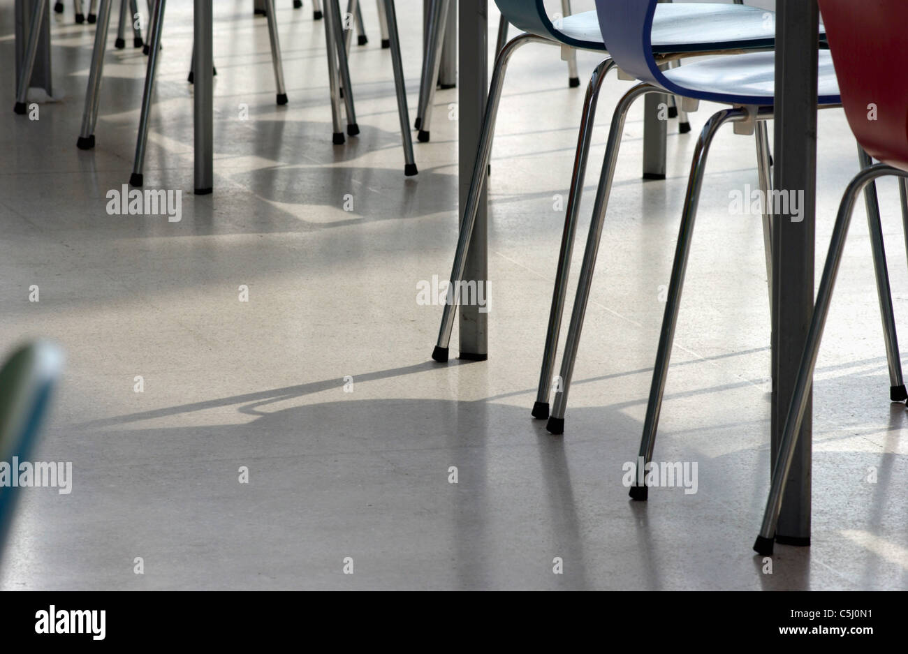 Dining room chair legs Stock Photo - Alamy