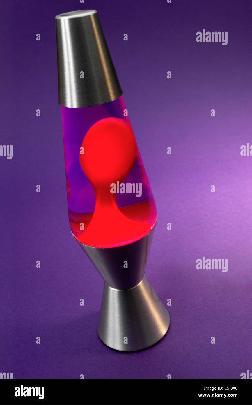 lava lamp with red inside on a purple background Stock Photo - Alamy