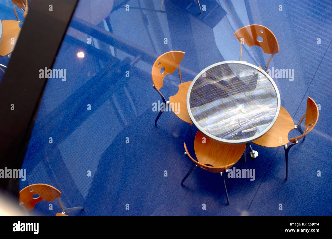 aerial view of tables and chairs on a blue floor Stock Photo - Alamy