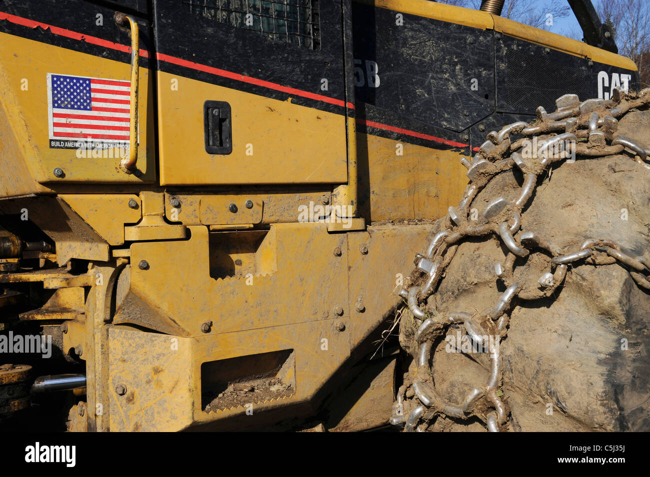 Caterpillar log skidding machine with chained tires in Eden, Vermont ...
