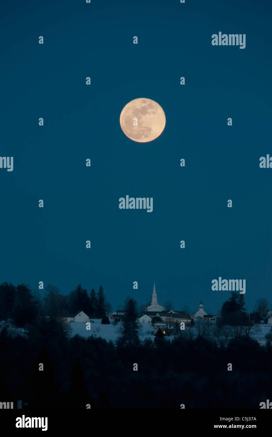 full moon over a church and small town at night Stock Photo - Alamy