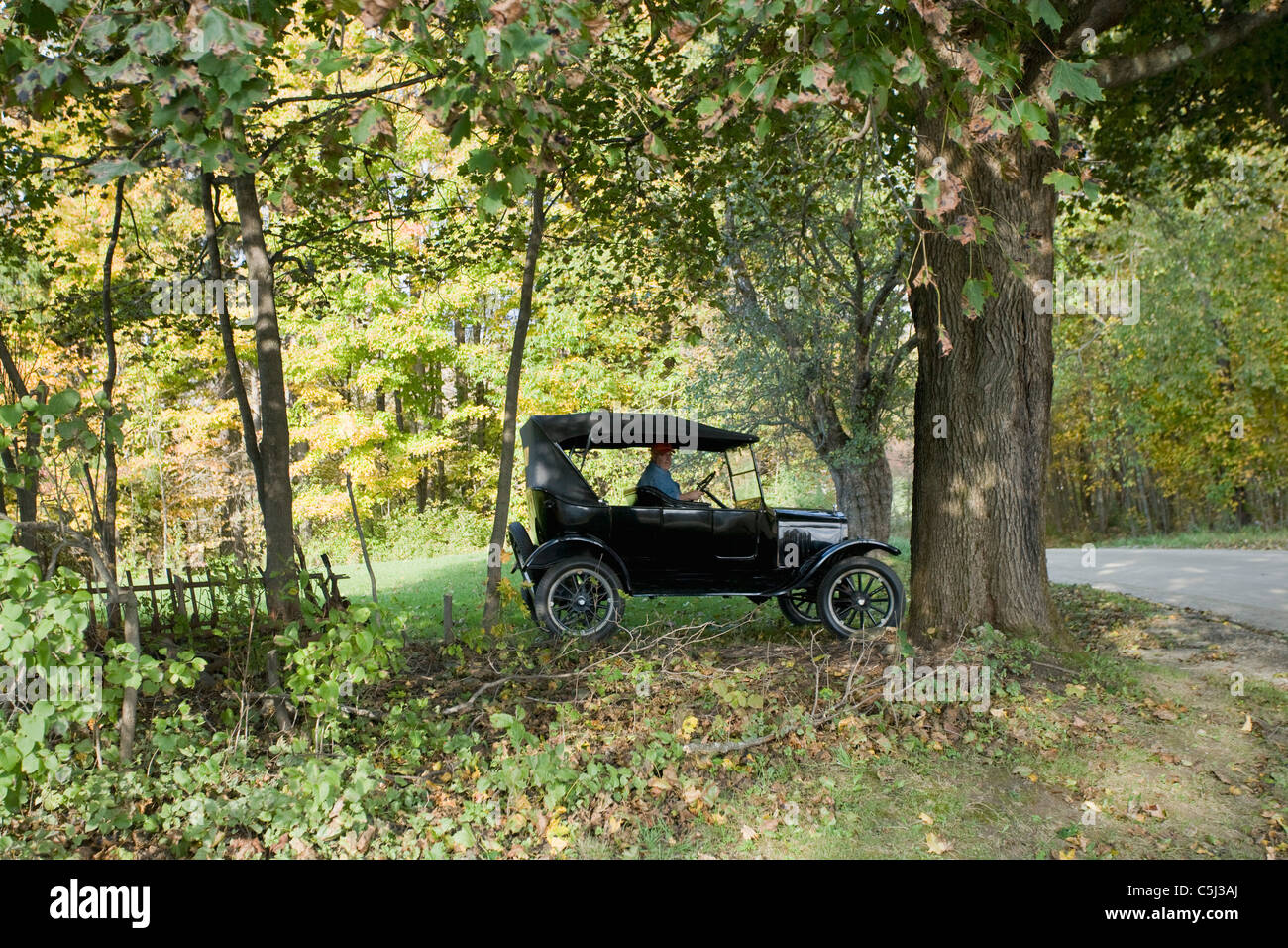 a man driving his Model T on the grass Stock Photo - Alamy
