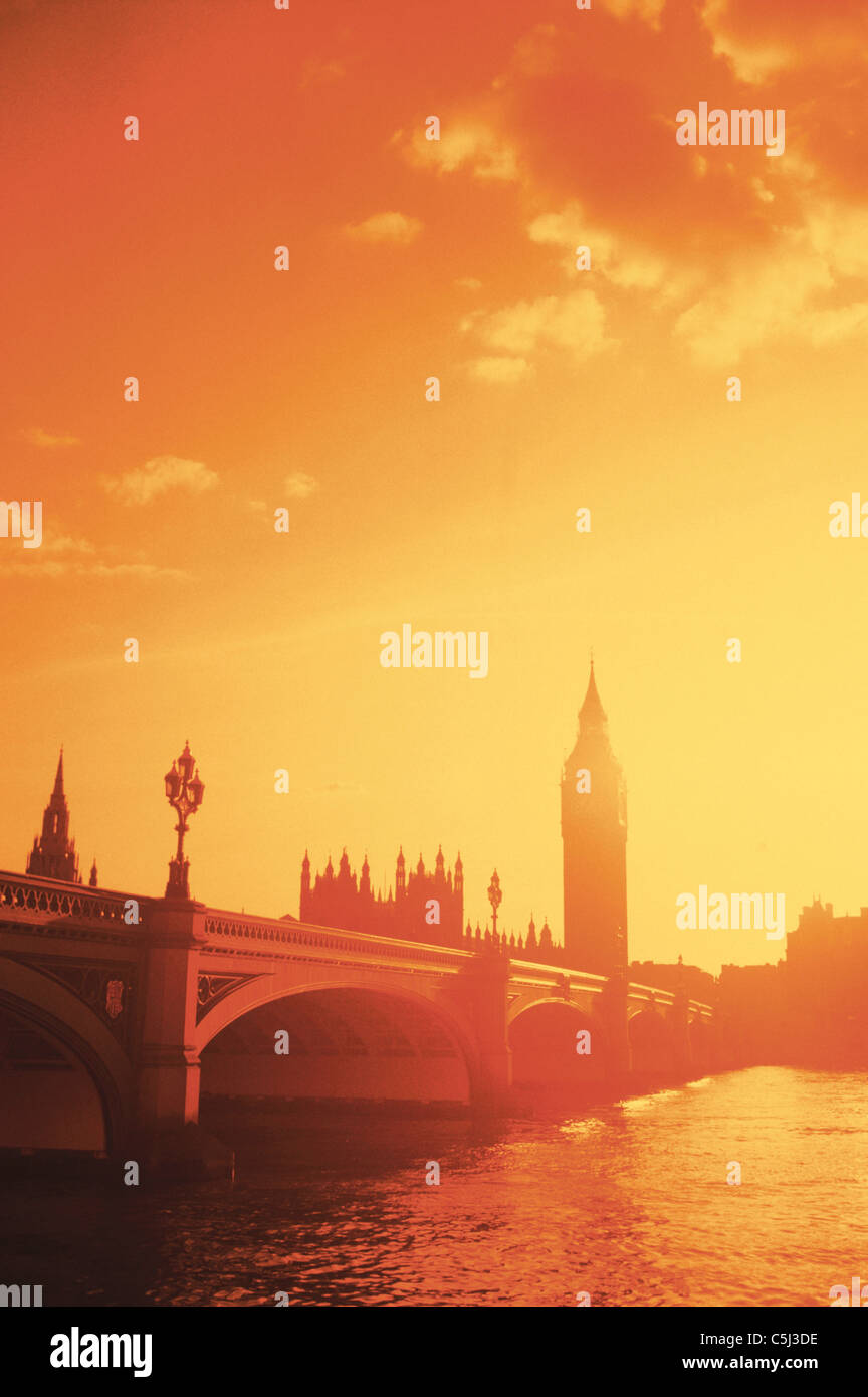 Orange hued Big Ben Clock Tower and Parliament building with ...