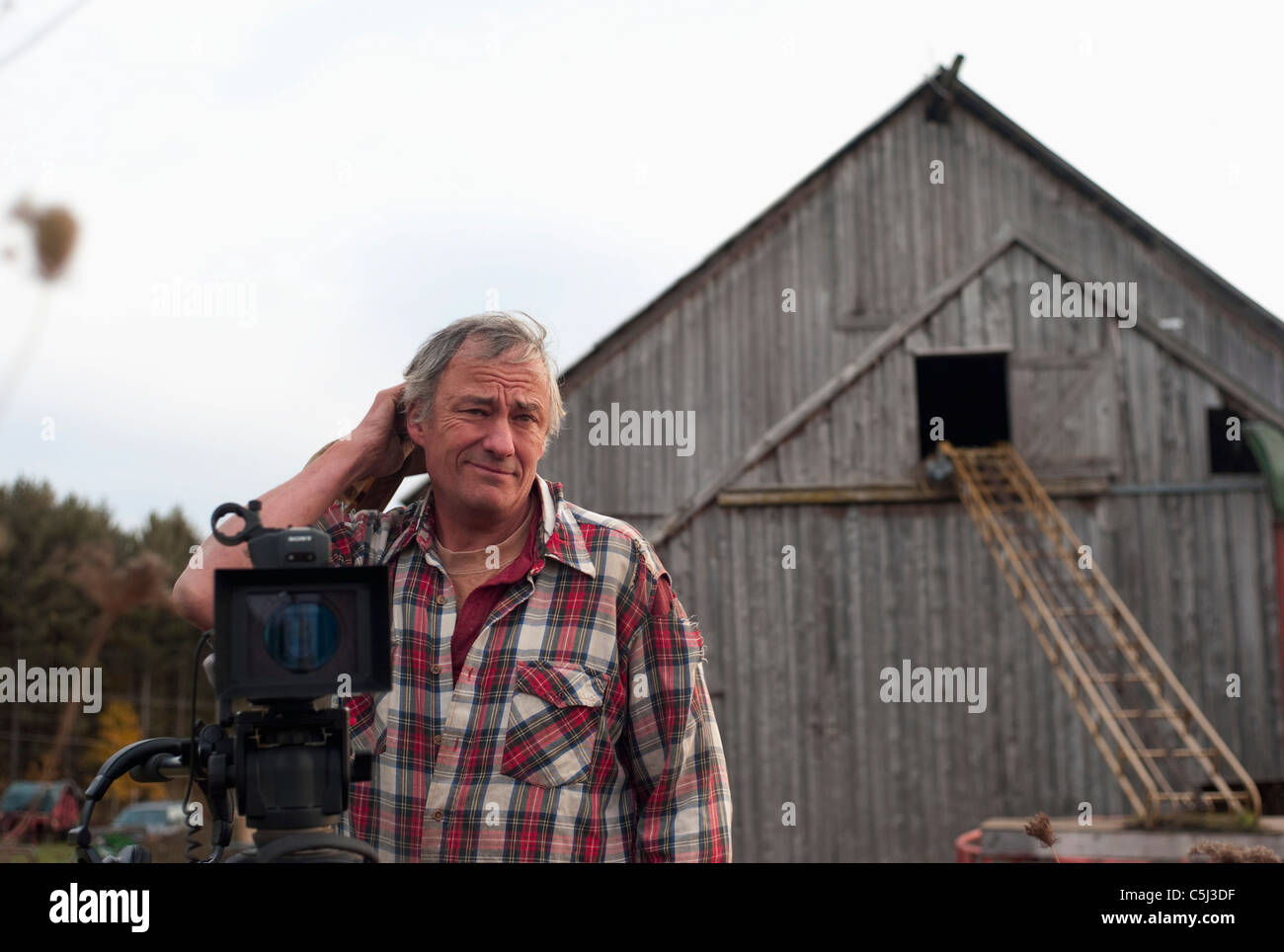 film producer standing behind his video camera Stock Photo - Alamy